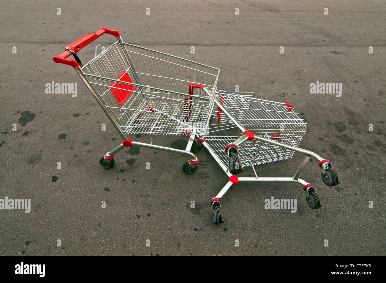 Shopping basket wheels on asphalt road Stock Photo - Alamy