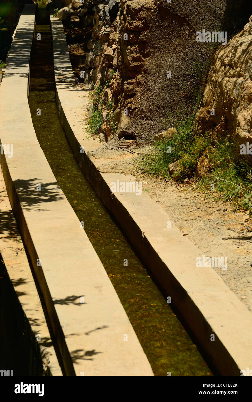 A falaj or irrigation channel in a mountain village in the Jabal al ...