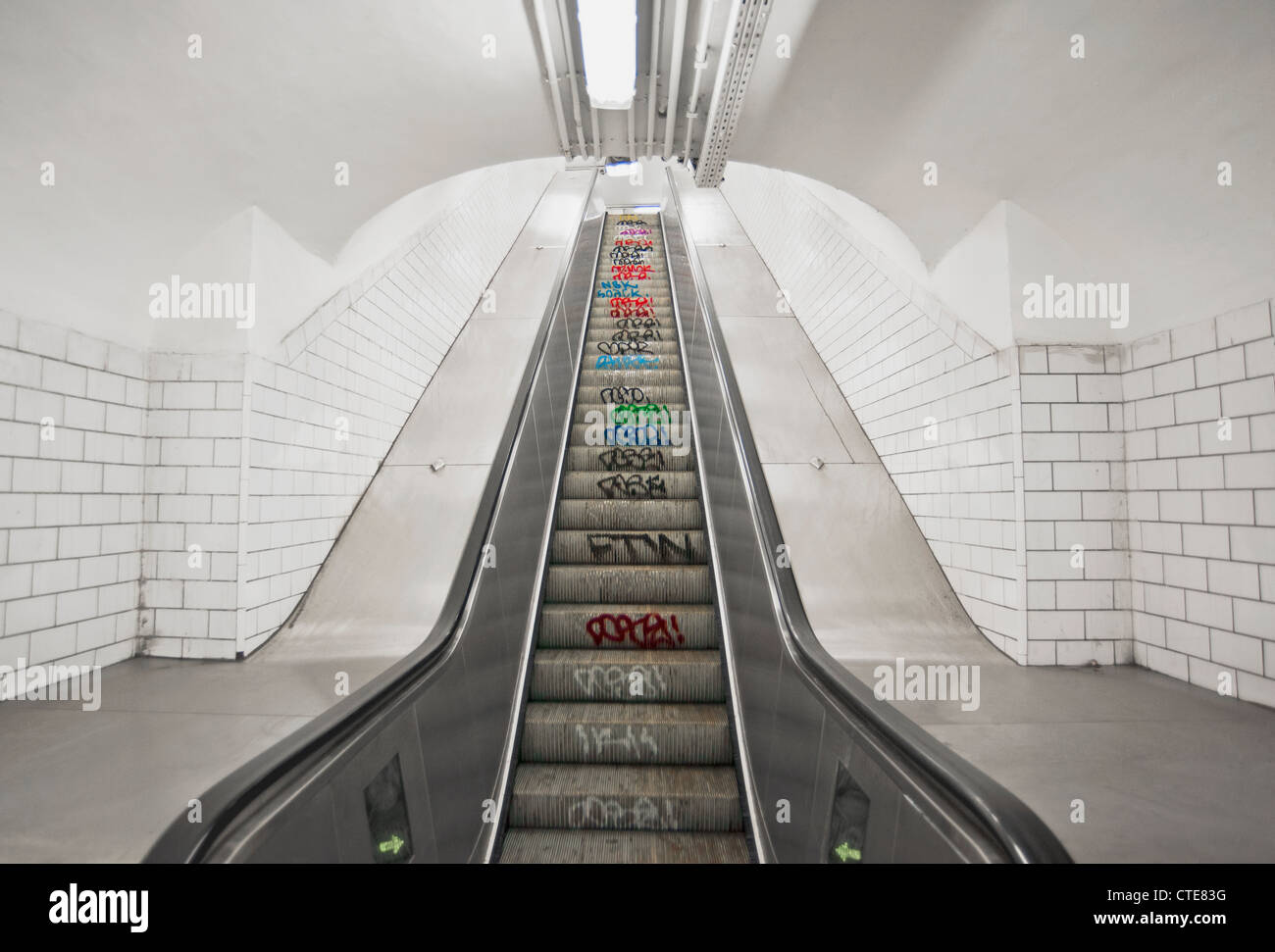 Escalator down to an underground Metro Station in Paris. Transport ...