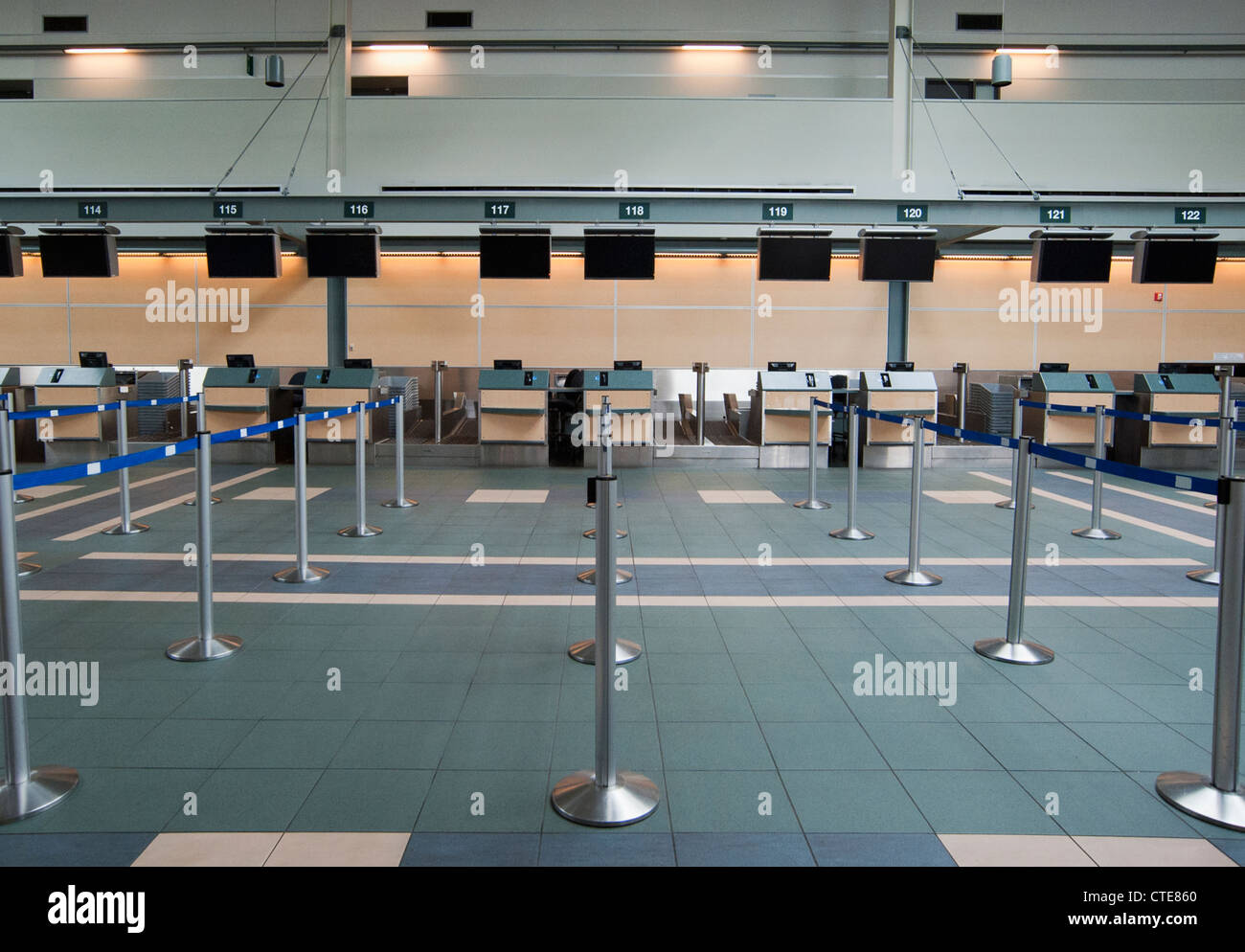 Rows of closed check in desks at Vancouver Airport. Blank information ...