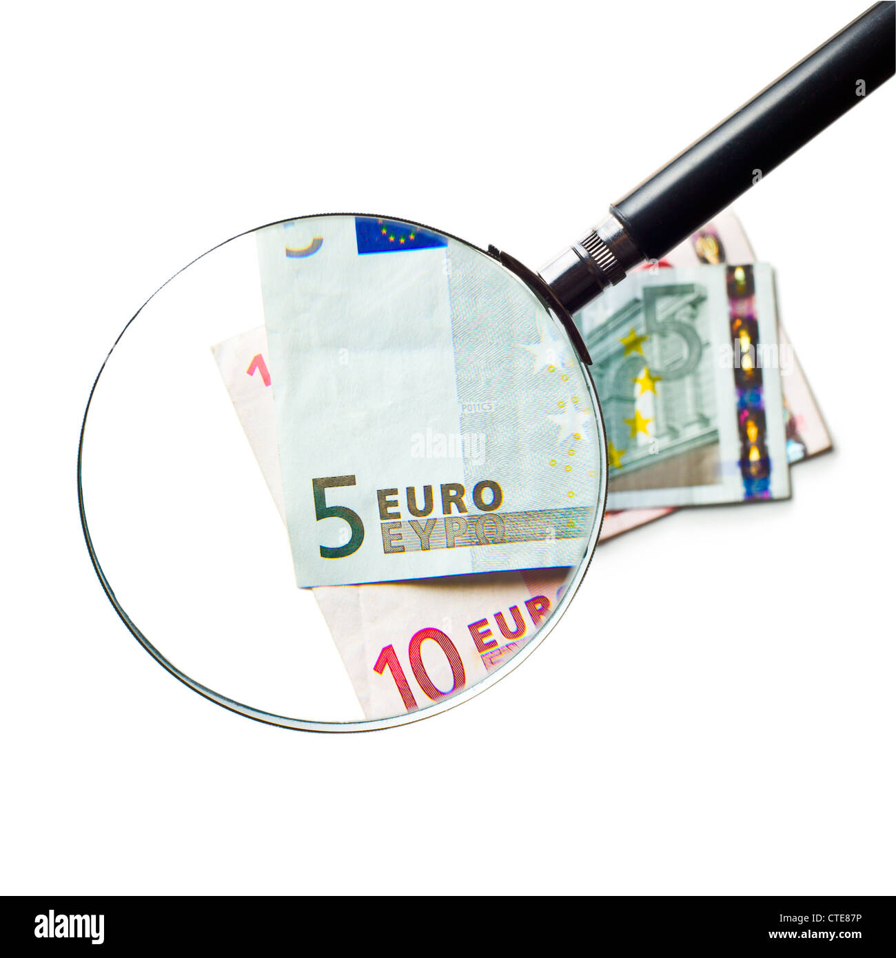 the euro currency under a magnifying glass on white background Stock ...