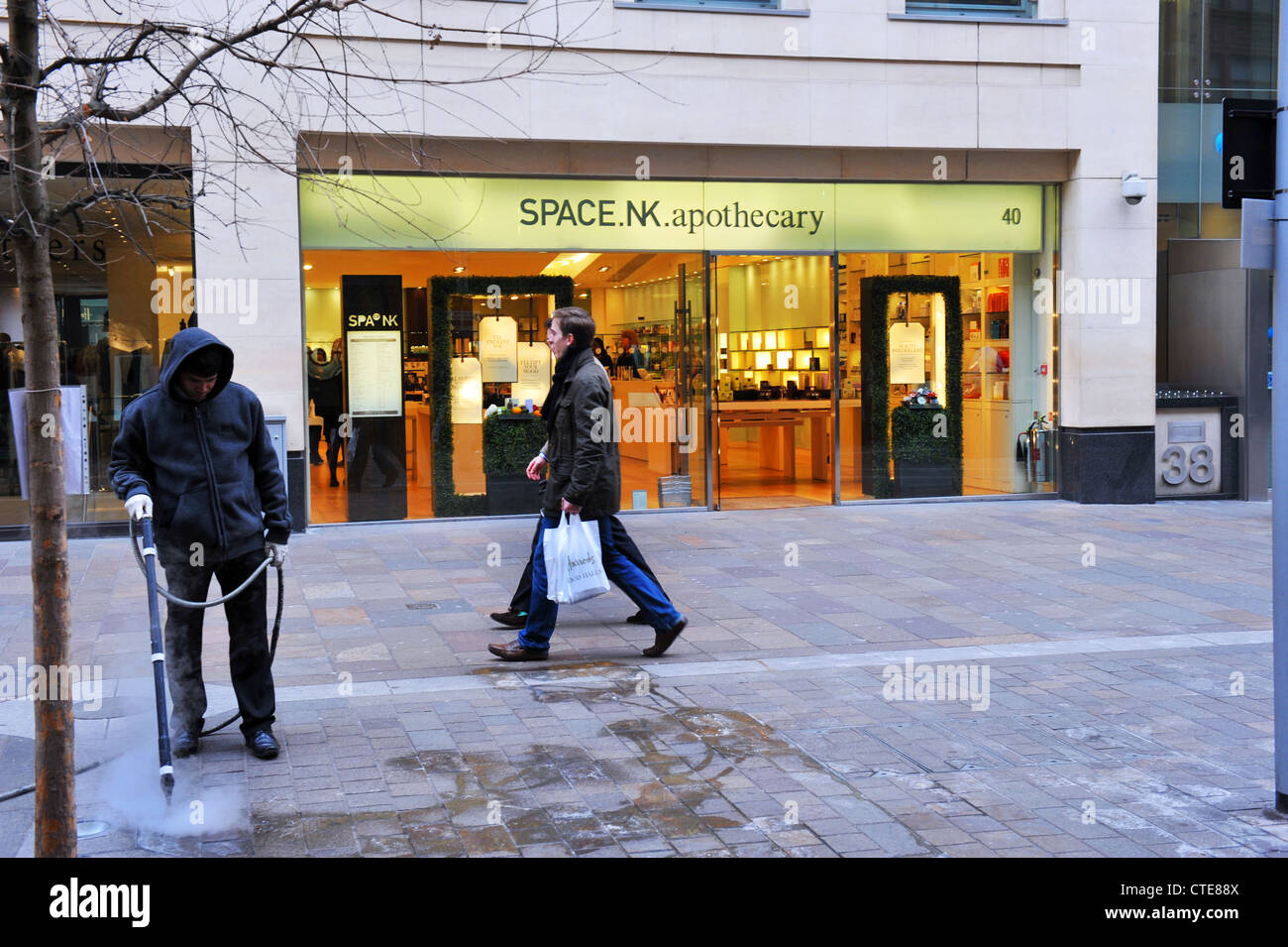 Rich and poor on a street in Knightsbridge, London UK Stock Photo - Alamy