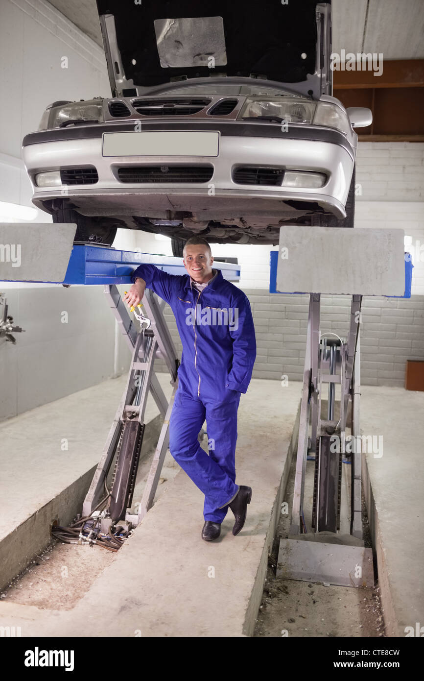 Mechanic leaning on machine hi-res stock photography and images - Alamy