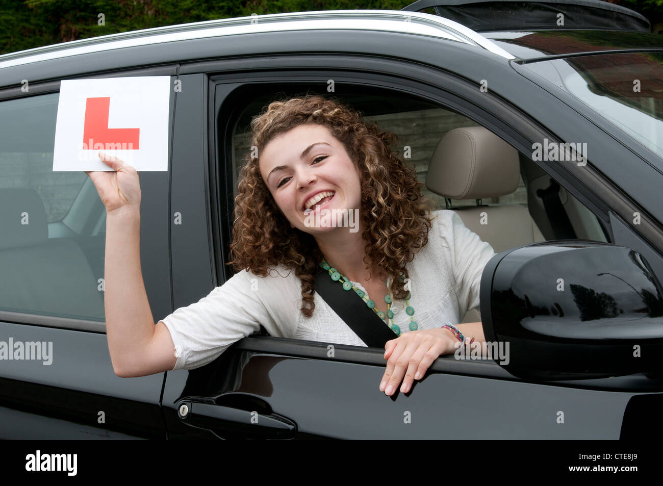 Waving smiling learner driver hi-res stock photography and images - Alamy