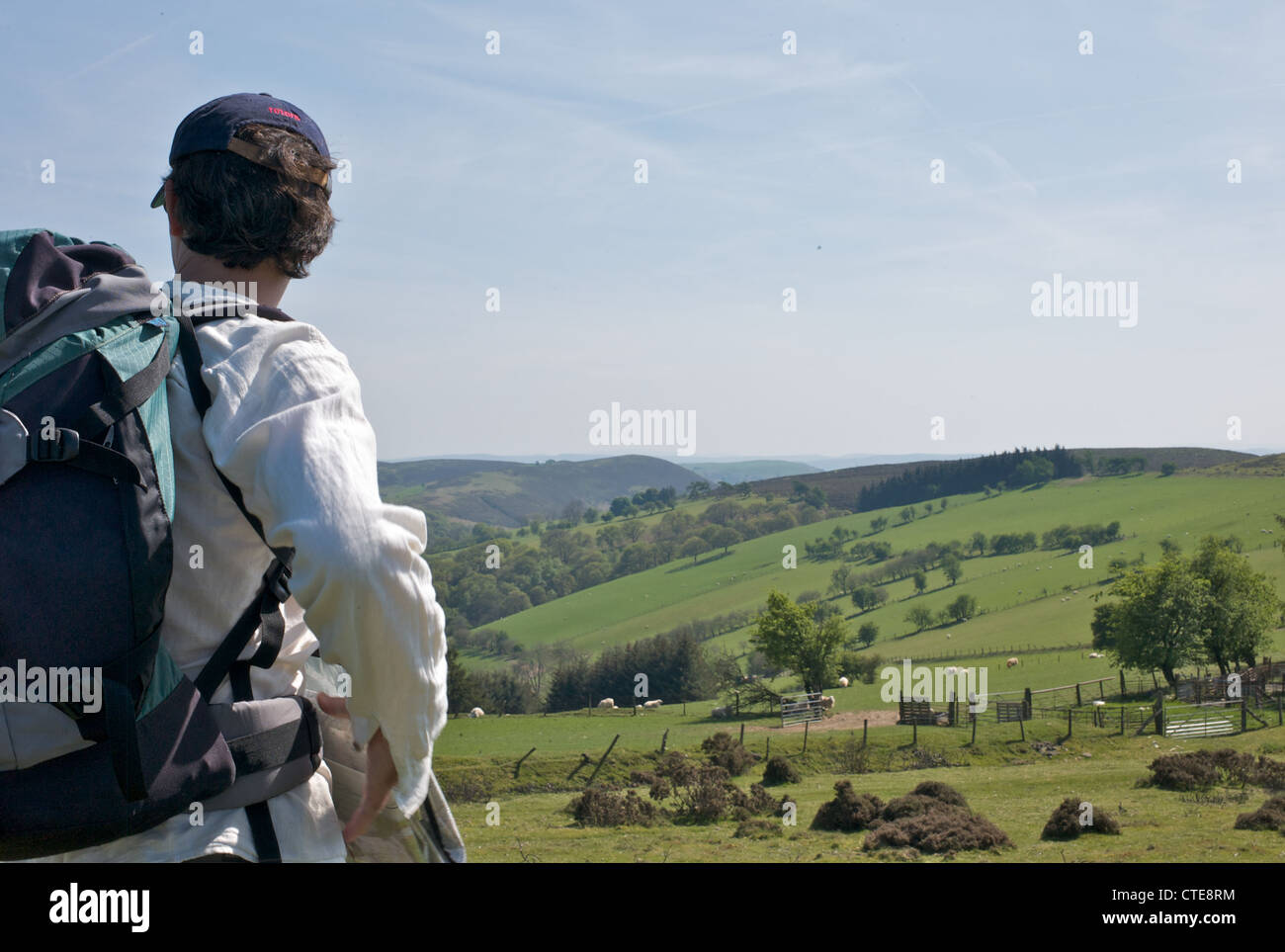Man walking in countryside and taking in view Stock Photo - Alamy
