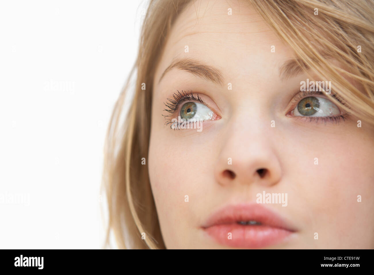 Woman looking up Stock Photo - Alamy
