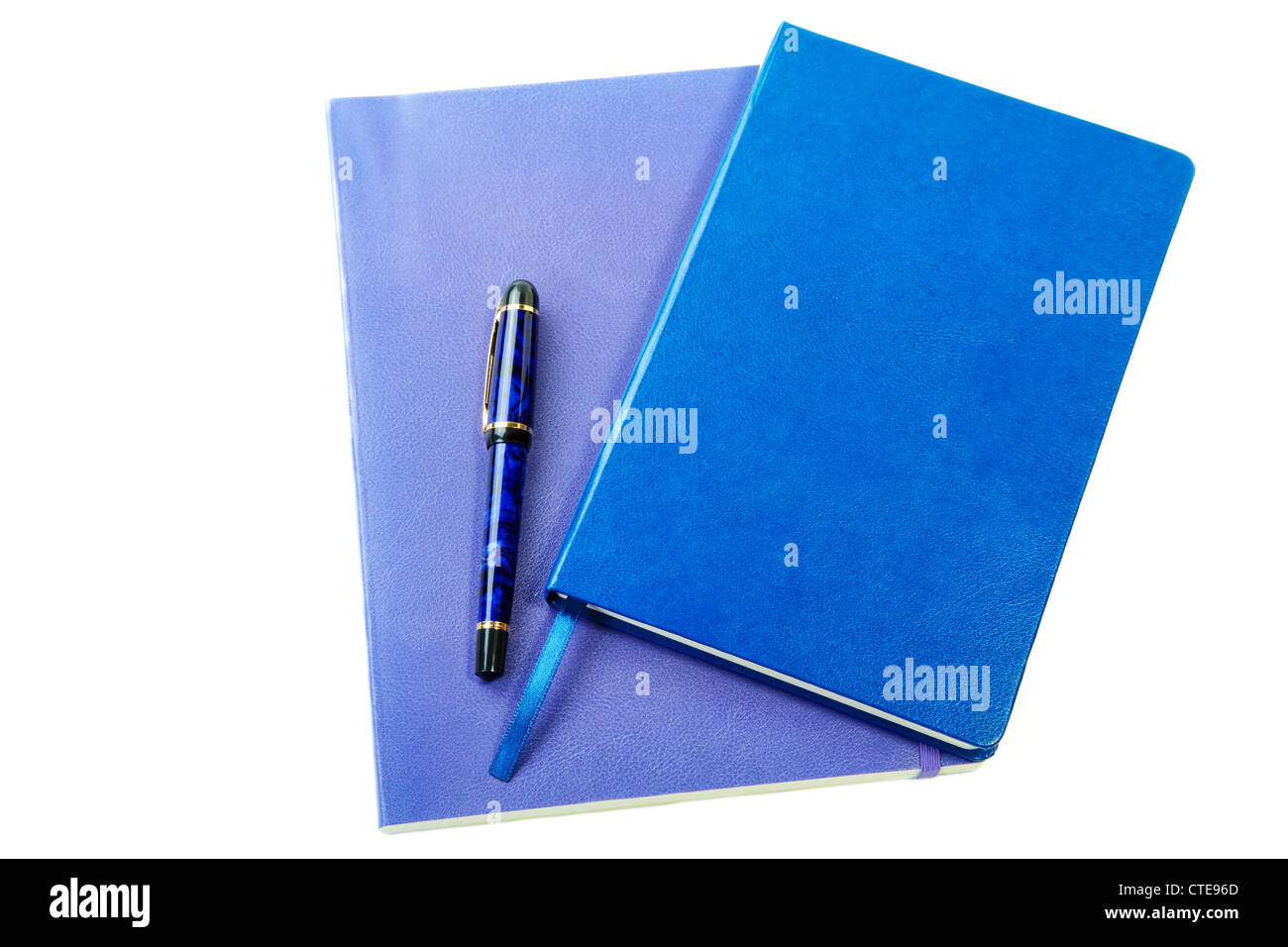 Dark blue writing-books and fountain pen isolated on a white background ...