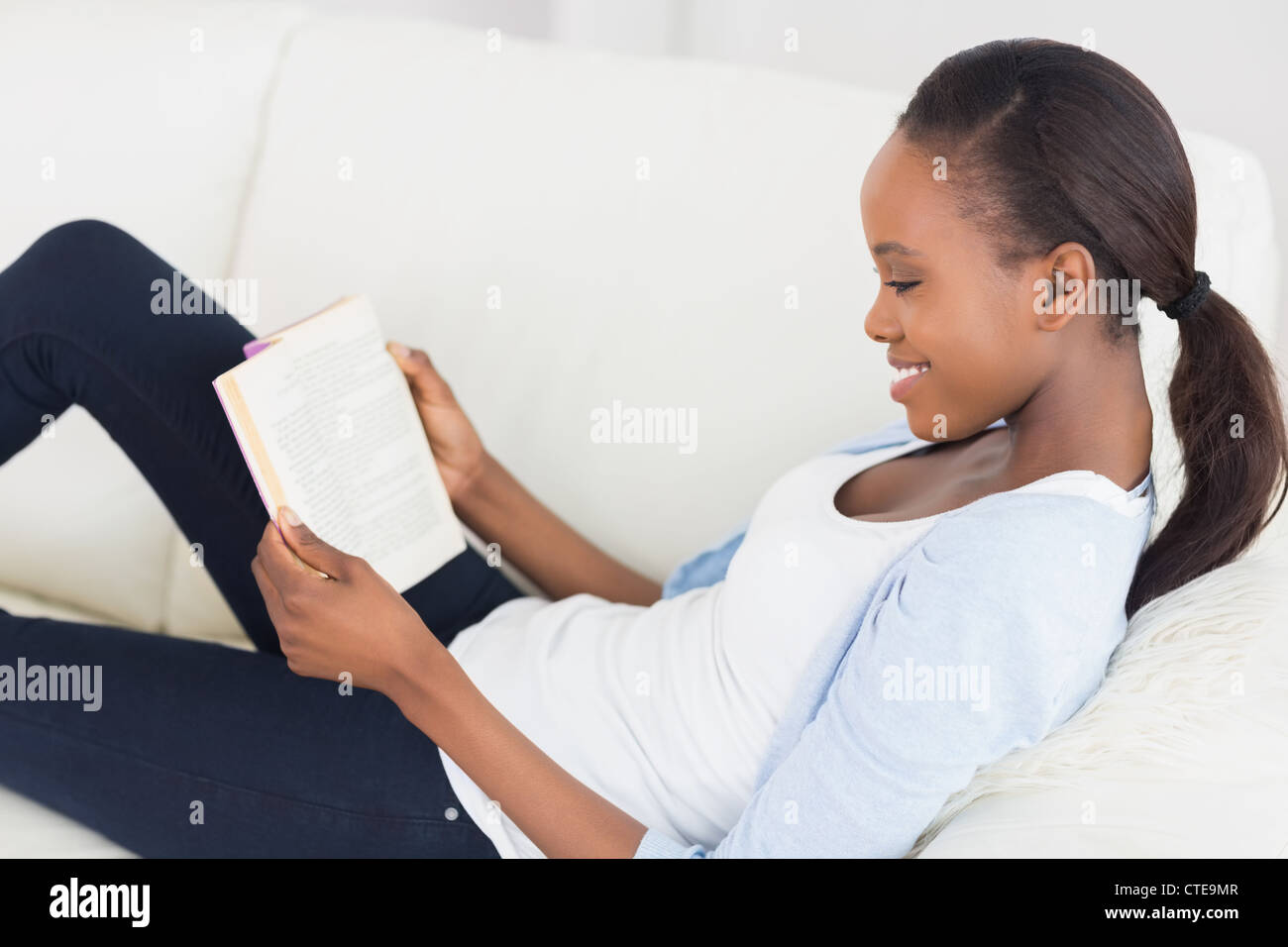 Black woman reading a book Stock Photo - Alamy