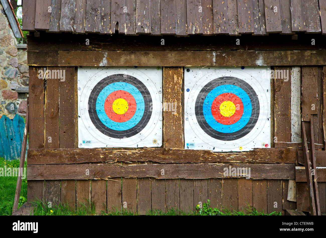 two targets for archers arrows on wooden wall Stock Photo - Alamy