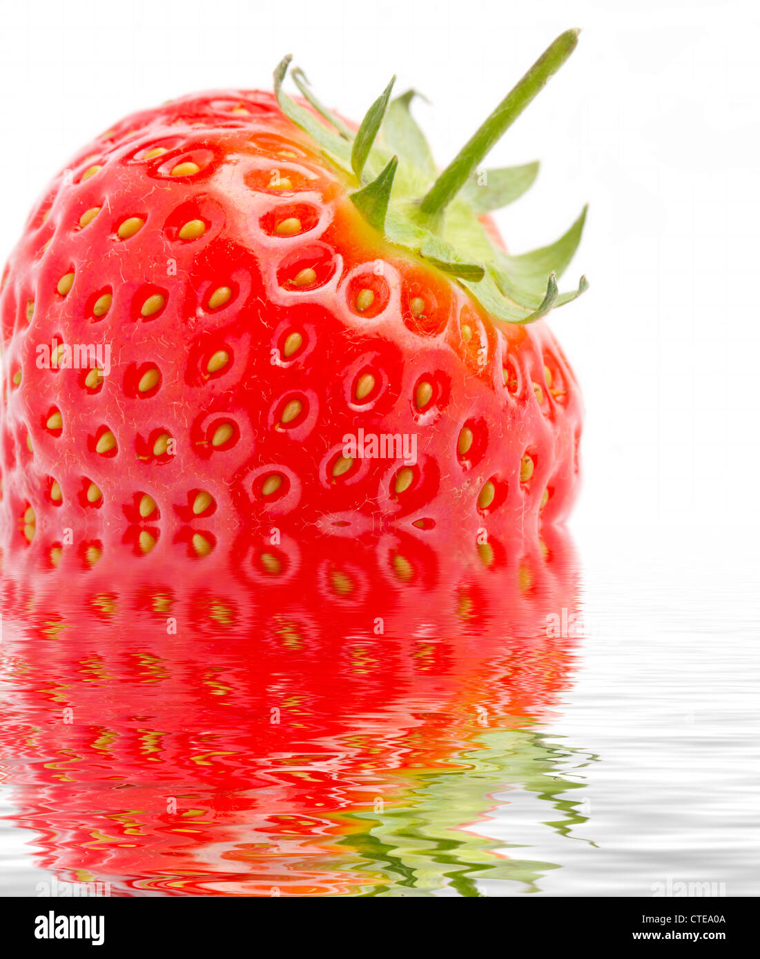 Ripe red strawberry with ripple reflection Stock Photo - Alamy