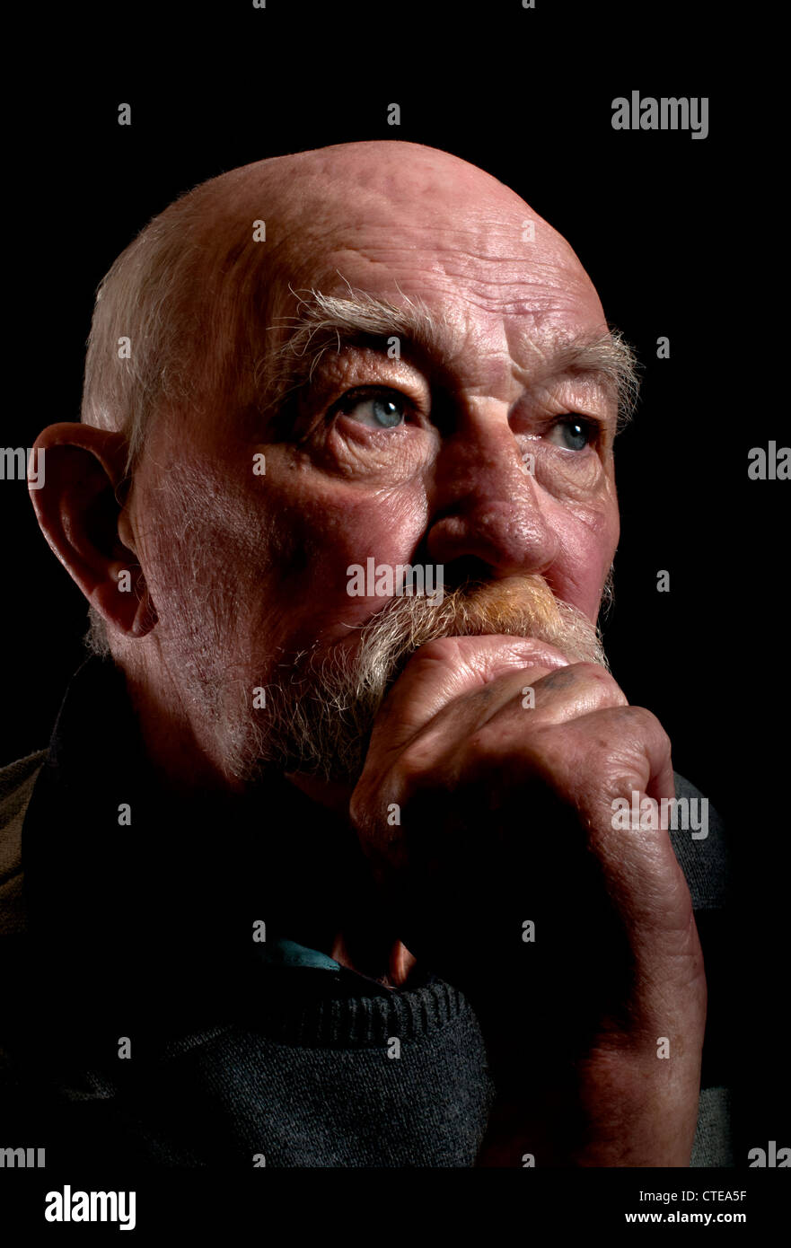 Senior man thinking Stock Photo - Alamy