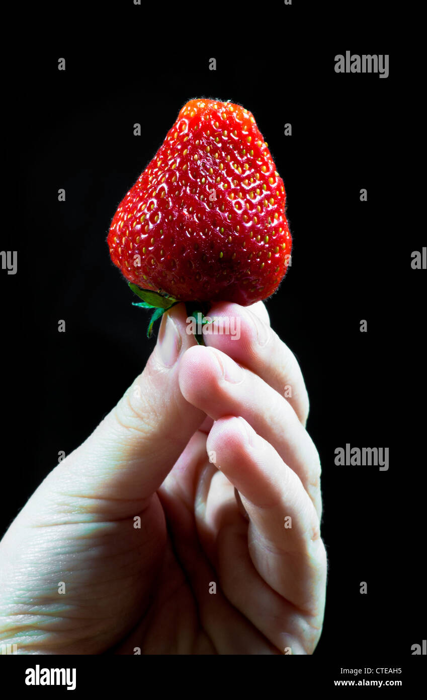 Low key strawberry Stock Photo - Alamy