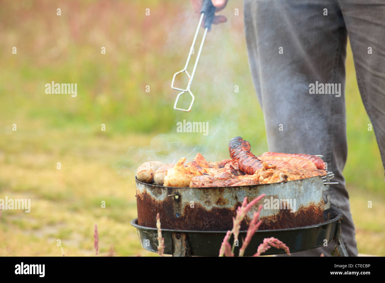 Barbecue with delicious grilled meat on grill BBQ Stock Photo - Alamy