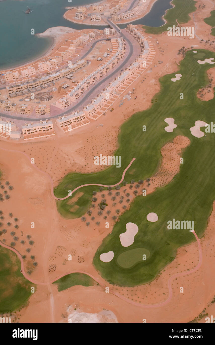 Aerial view of residential villas and golf fairways, Ras al-Khaimah ...