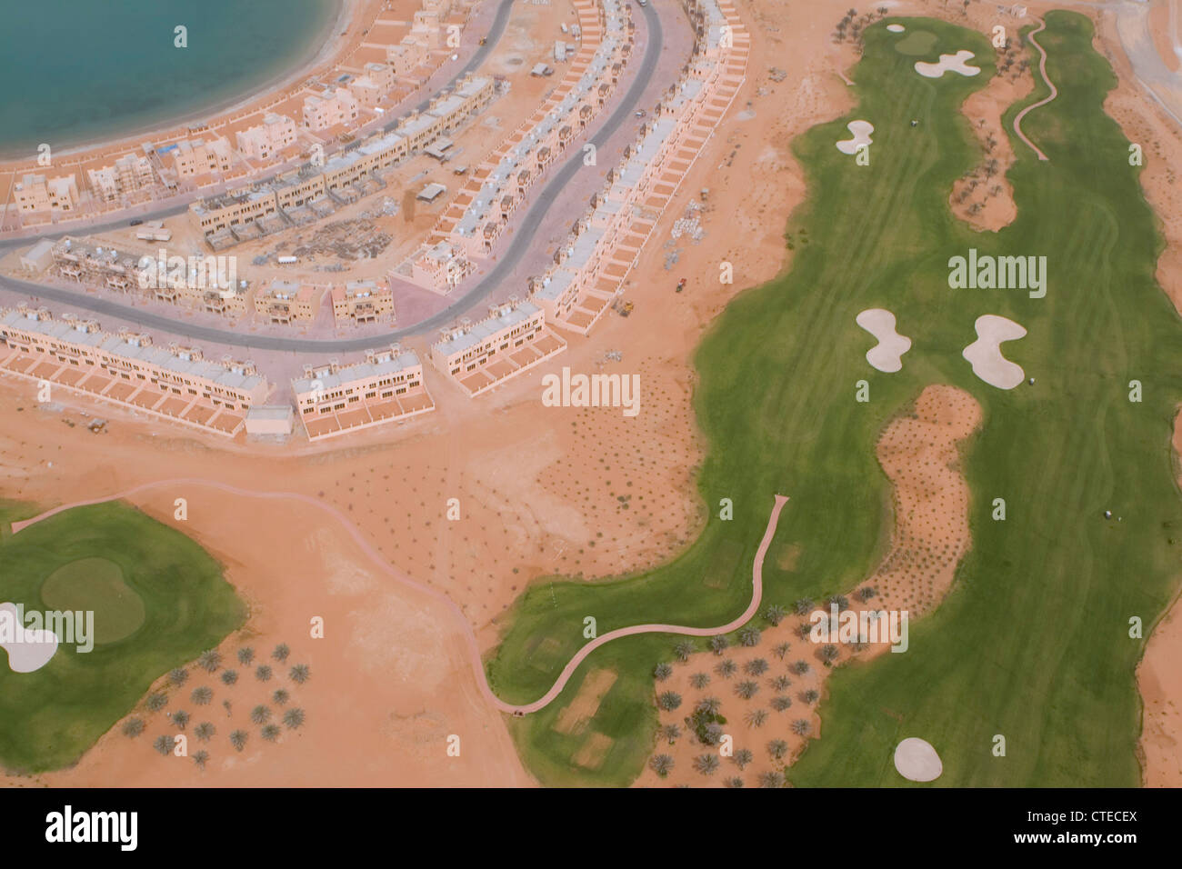 Aerial view of residential villas and golf fairways, Ras al-Khaimah ...