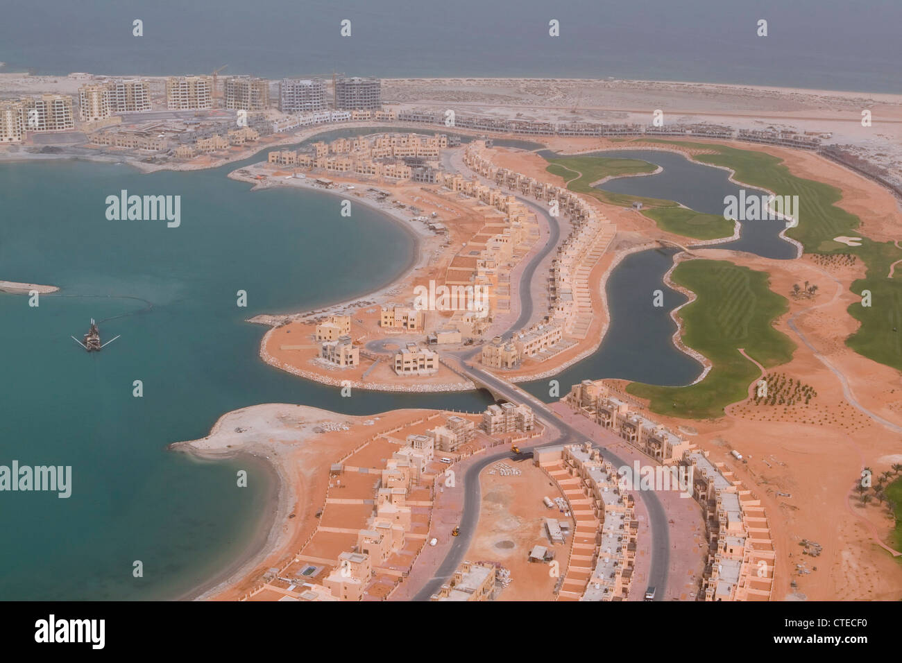 Aerial view of residential villas and golf fairways, Ras al-Khaimah ...
