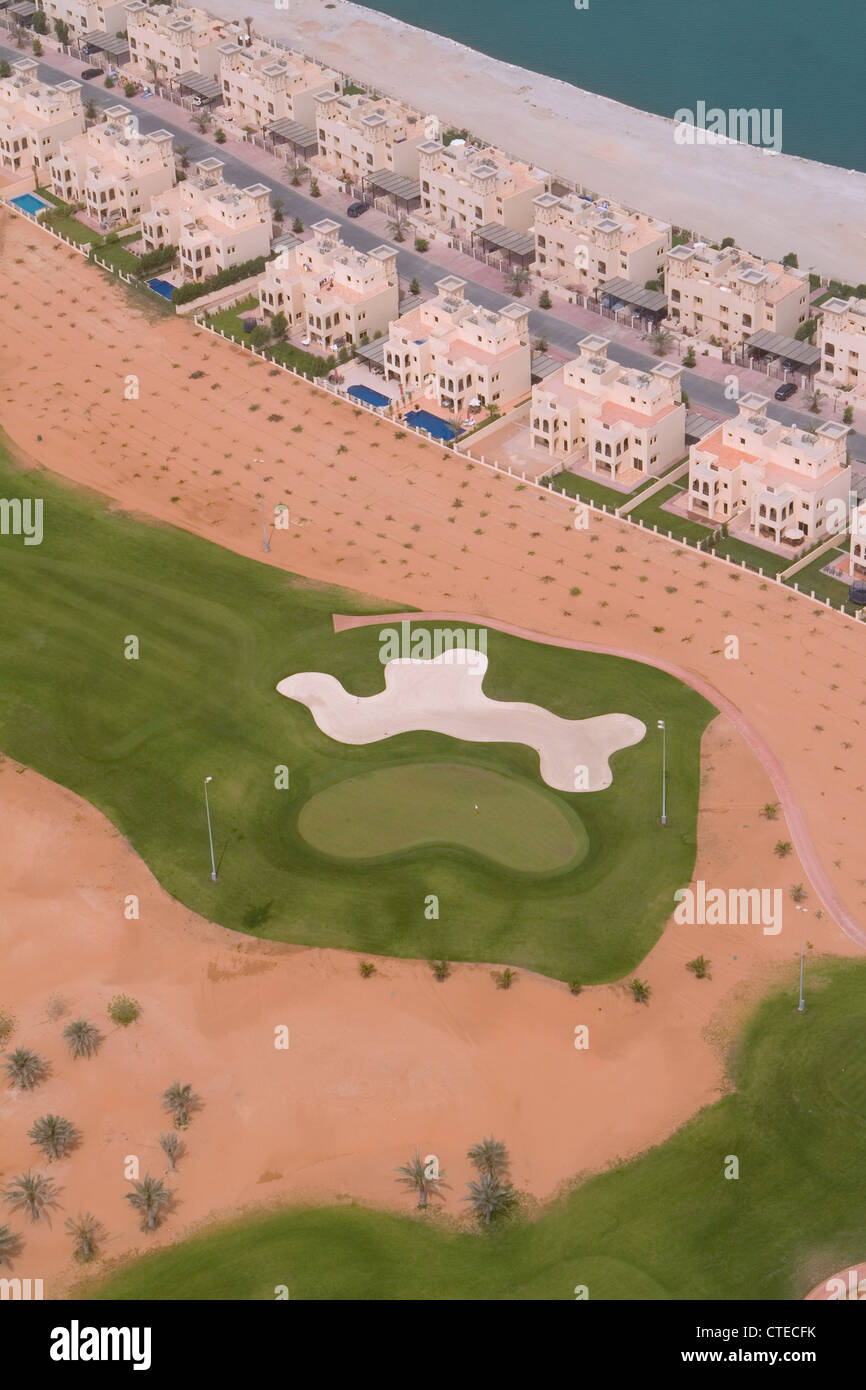 Aerial view of residential villas and golf fairways, Ras al-Khaimah ...