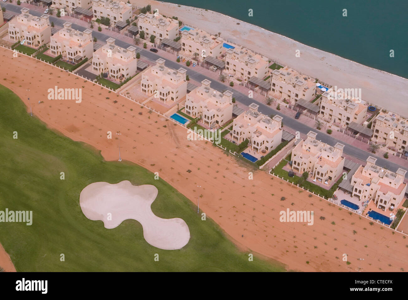 Aerial view of residential villas and golf fairways, Ras al-Khaimah ...