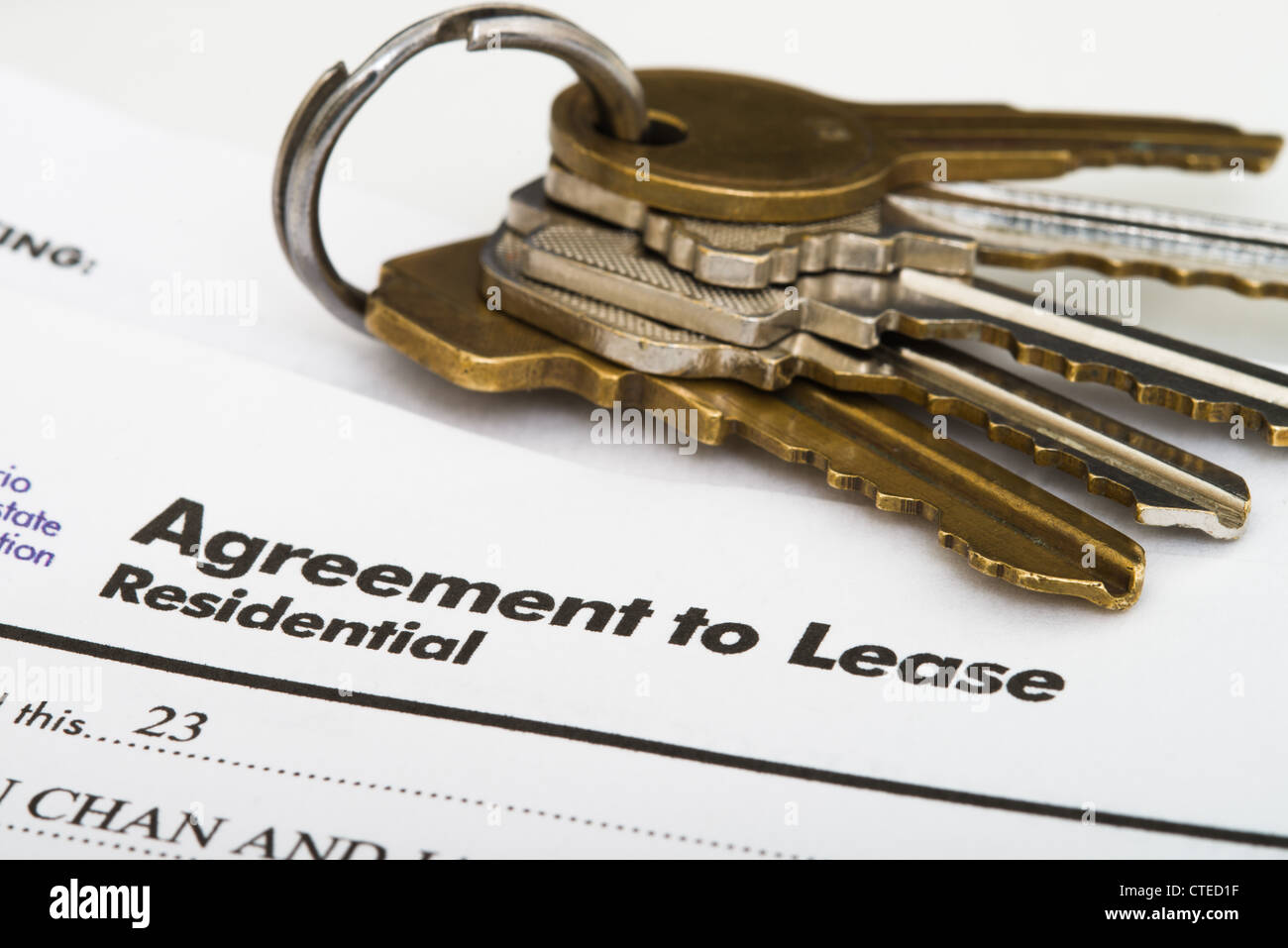 Keys and a lease agreement Stock Photo - Alamy