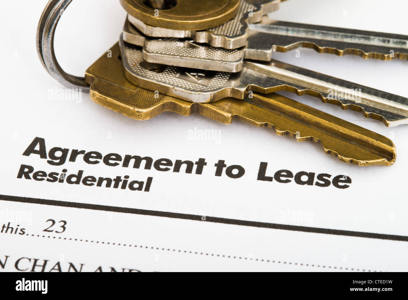 Keys and a lease agreement Stock Photo - Alamy