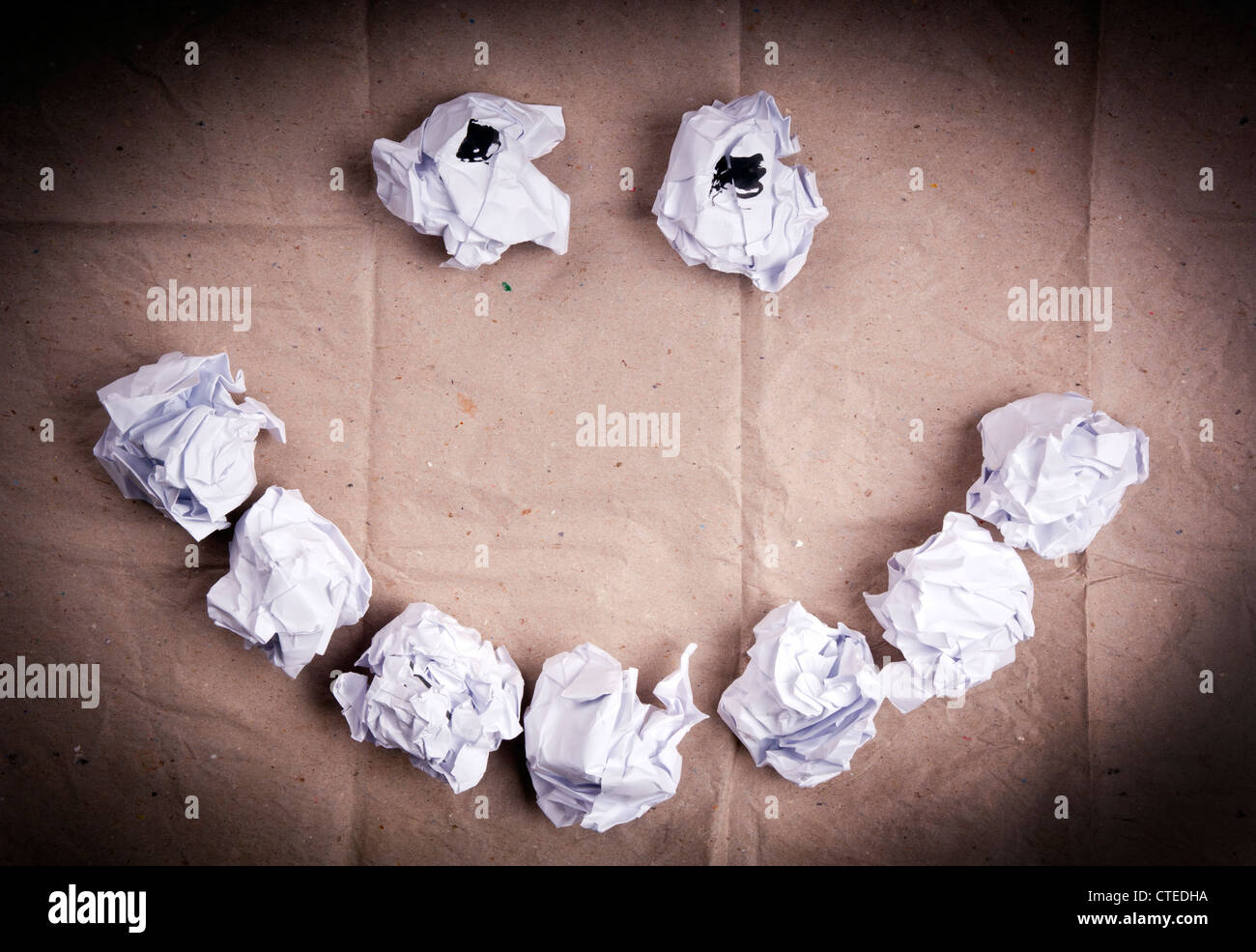 Crumpled up paper balls of white paper make a smiley face Stock Photo ...