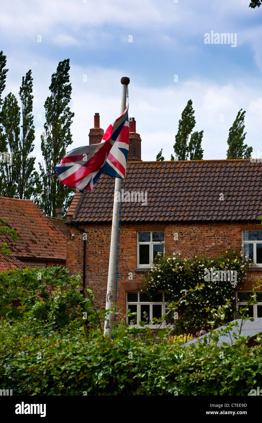 Farm house with union jack flag Stock Photo - Alamy