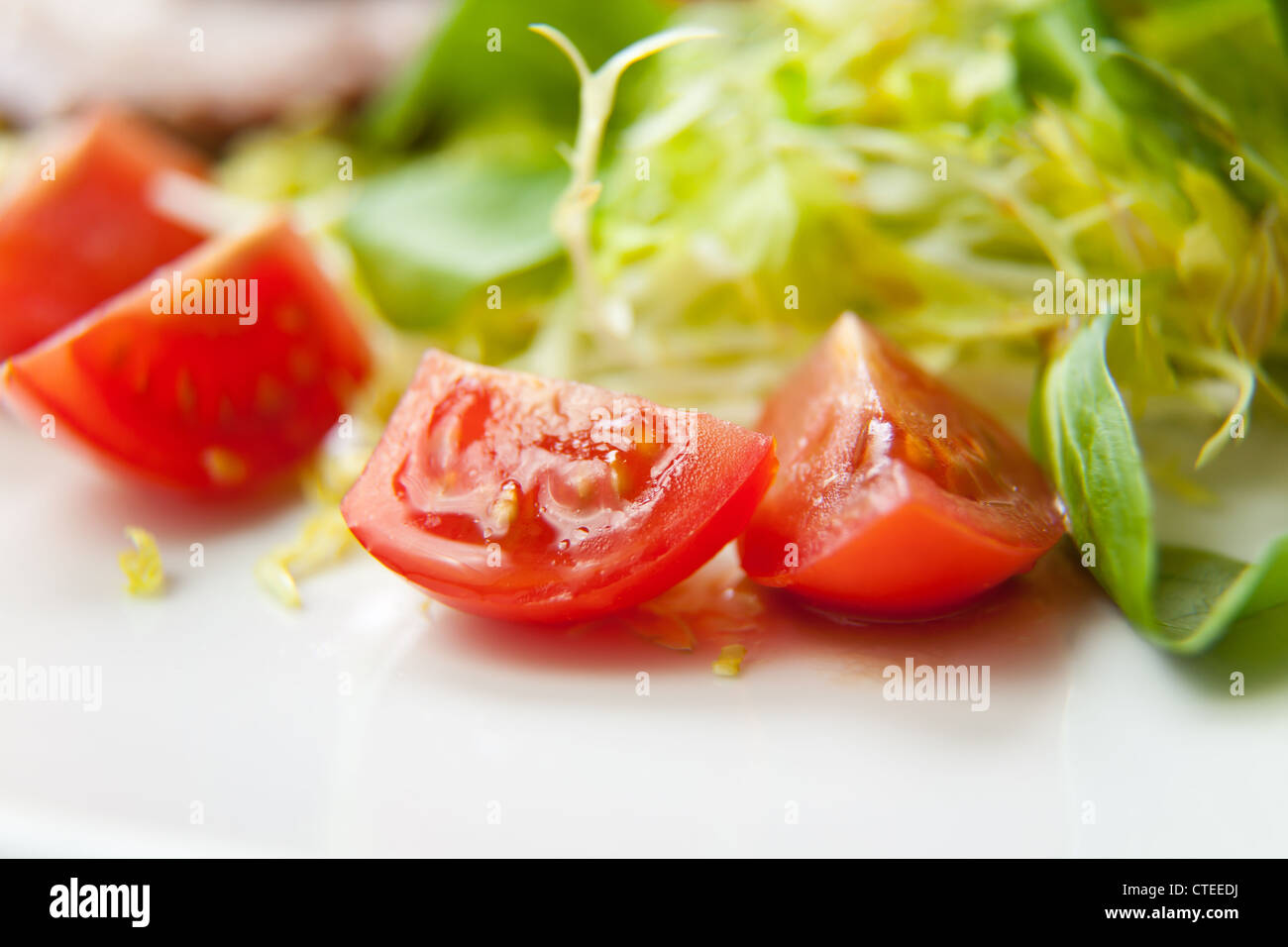 Fresh sliced tomatoes and salad Stock Photo - Alamy