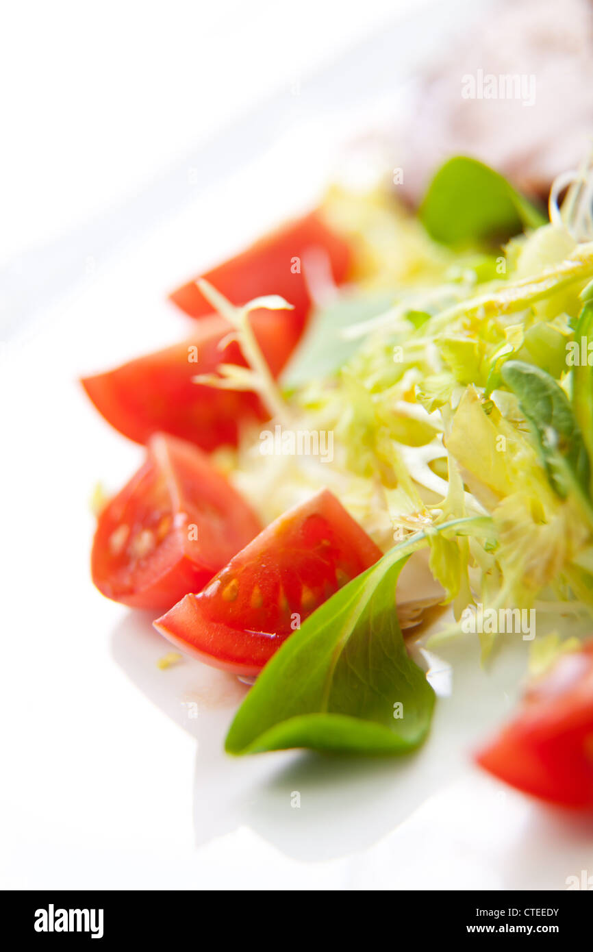 Fresh sliced tomatoes and salad Stock Photo - Alamy