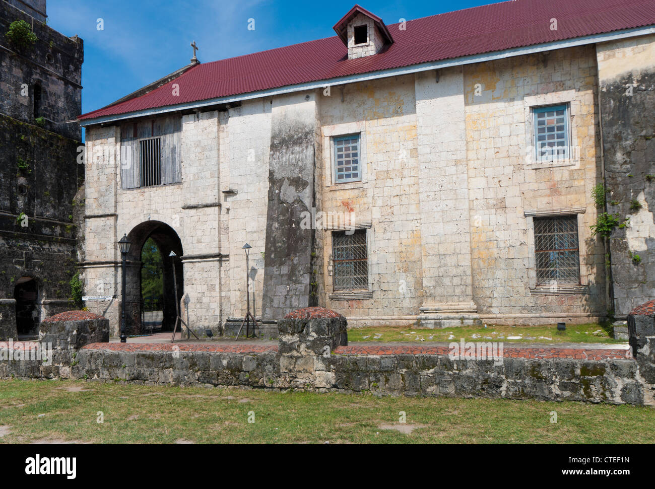 exterior of the Baclayon church on Bohol, Philippines. You can see the face of St. Padre Pio on ...