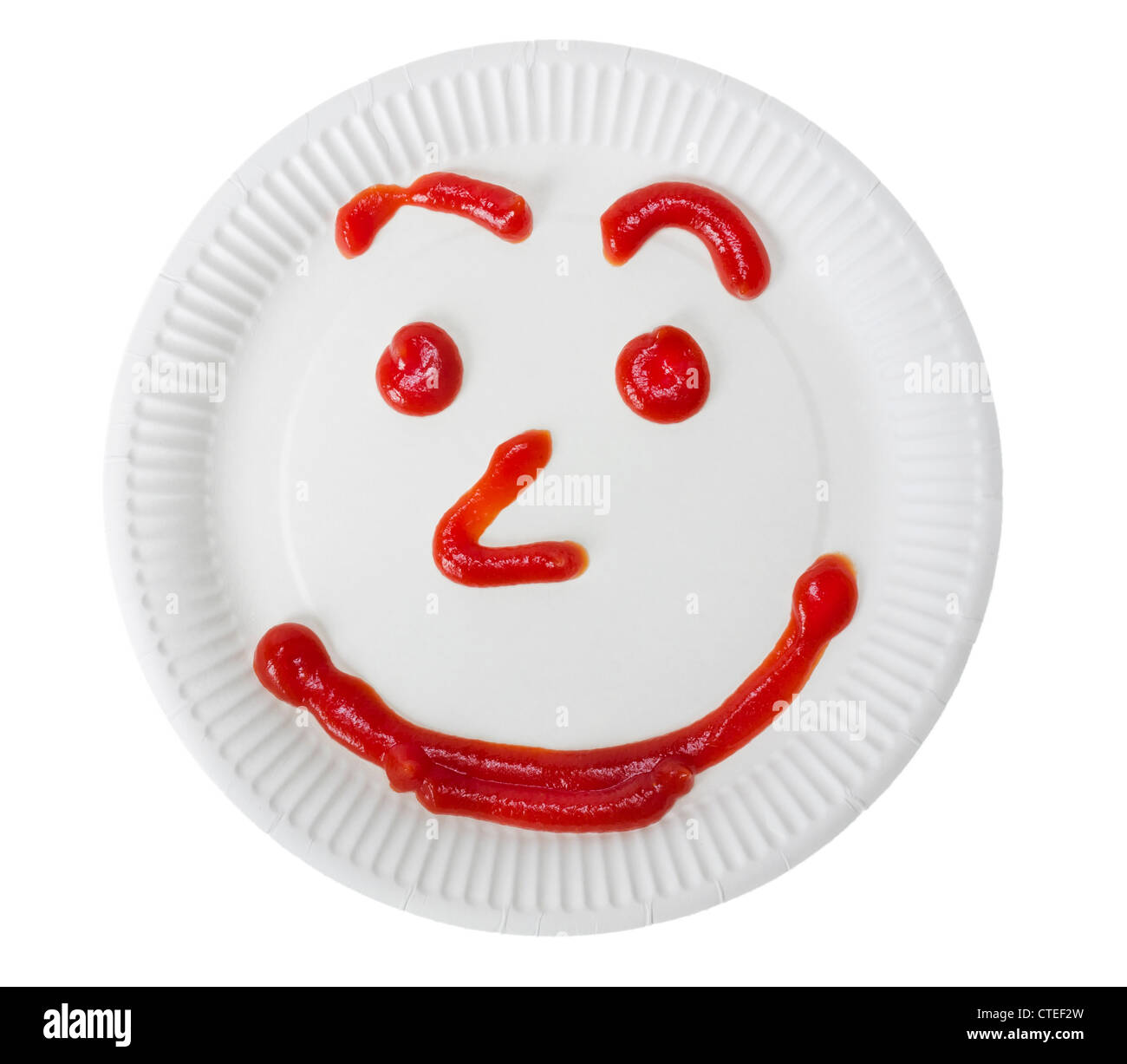 White paper plate and smile from red tomato ketchup isolated. Selective ...