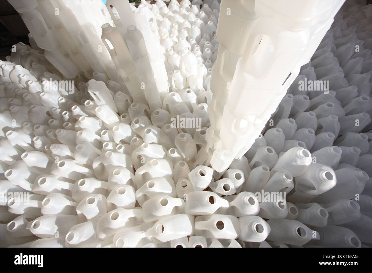 Empty milk plastic cartons in an art sculpture Stock Photo - Alamy