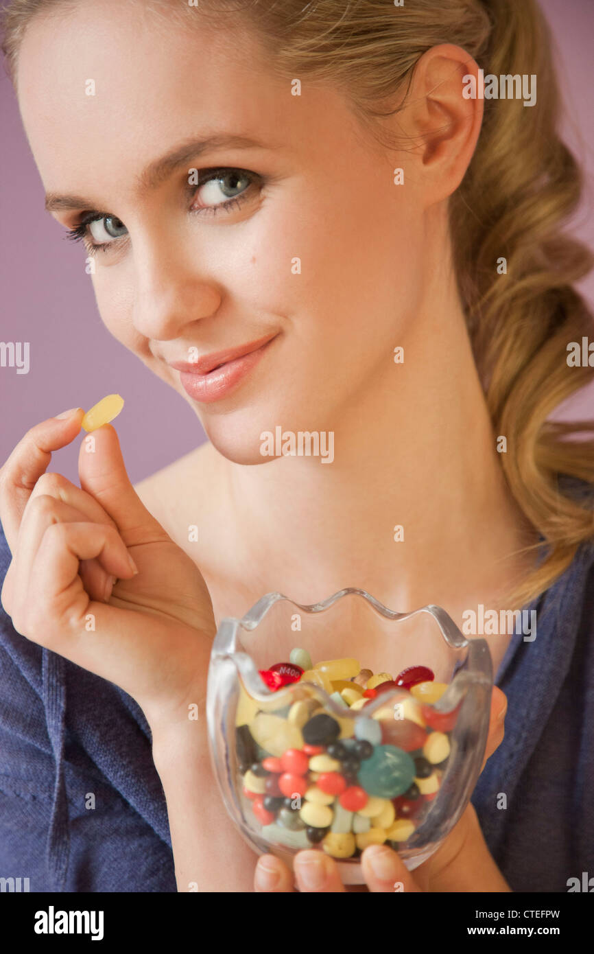 Woman taking vitamins Stock Photo - Alamy