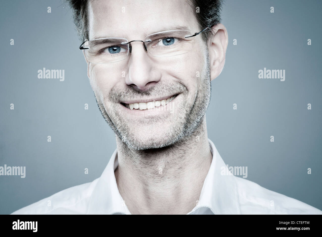 Portrait from a happy and smiling man Stock Photo - Alamy