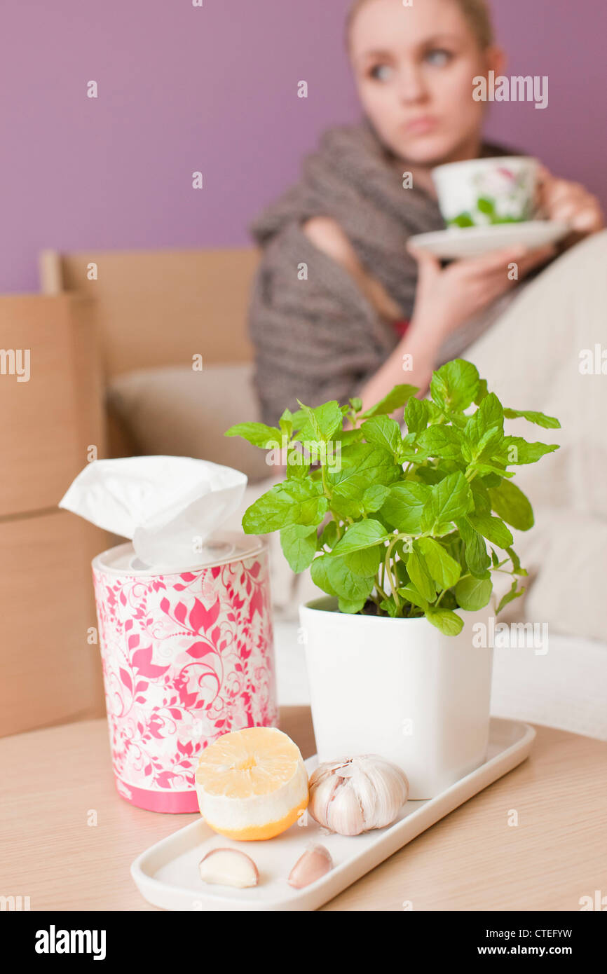 Sick woman drinking herbal tea Stock Photo - Alamy