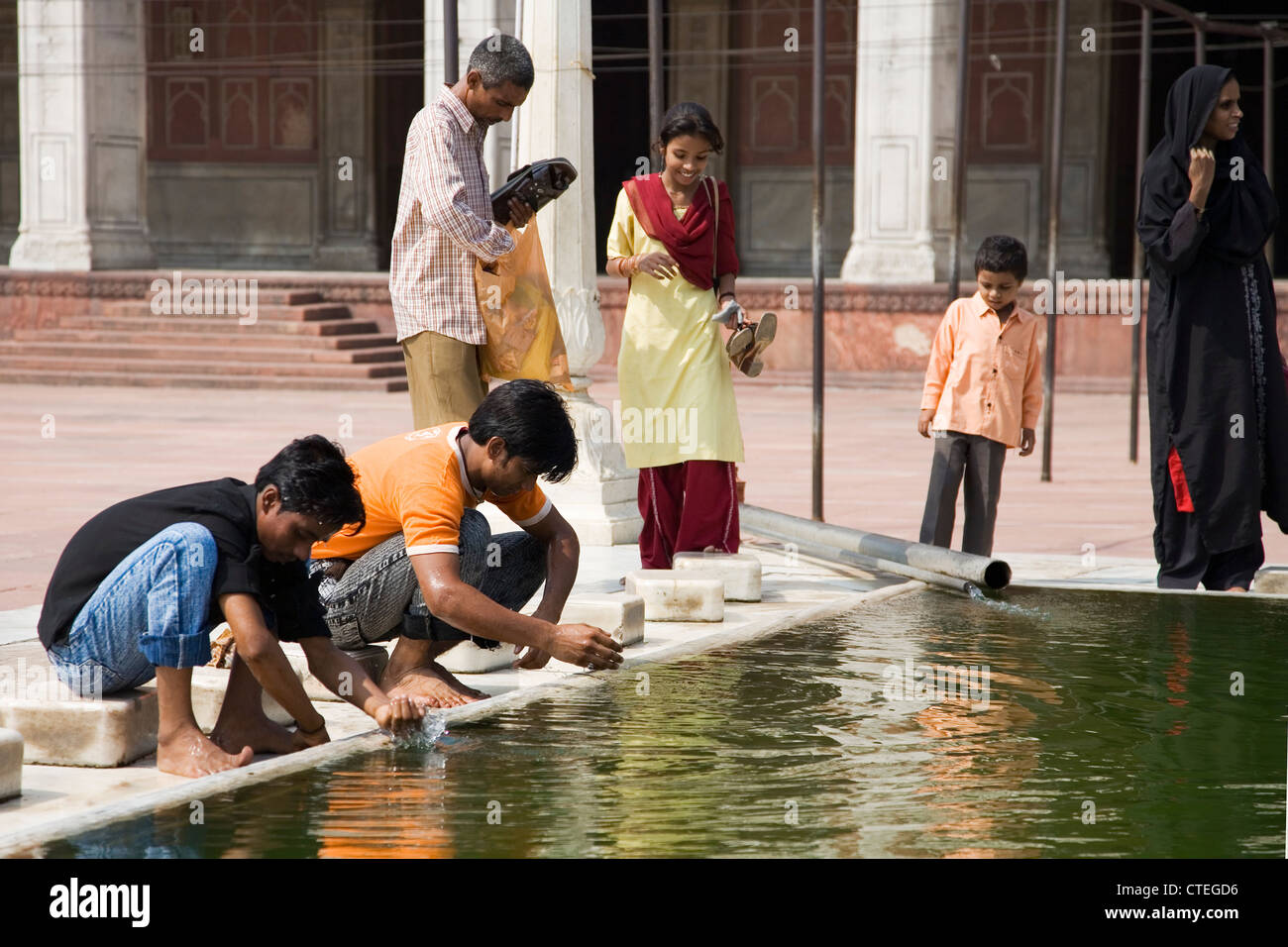 Muslims washing before prayer at the Jami Masjid Mosque in Delhi India ...