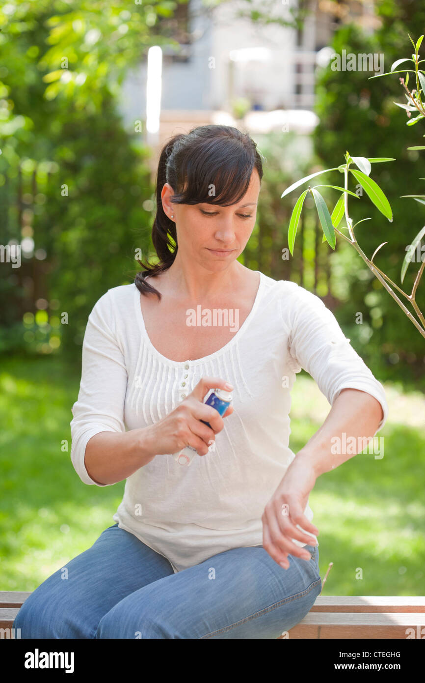 Woman mature insect spray hi-res stock photography and images - Alamy