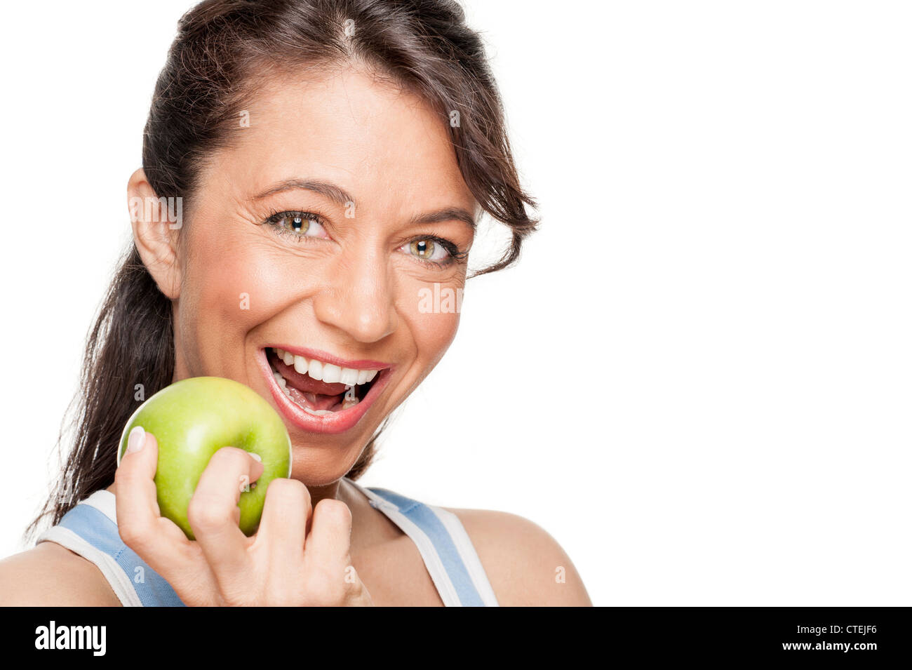 Woman with apple in front of white background Stock Photo - Alamy