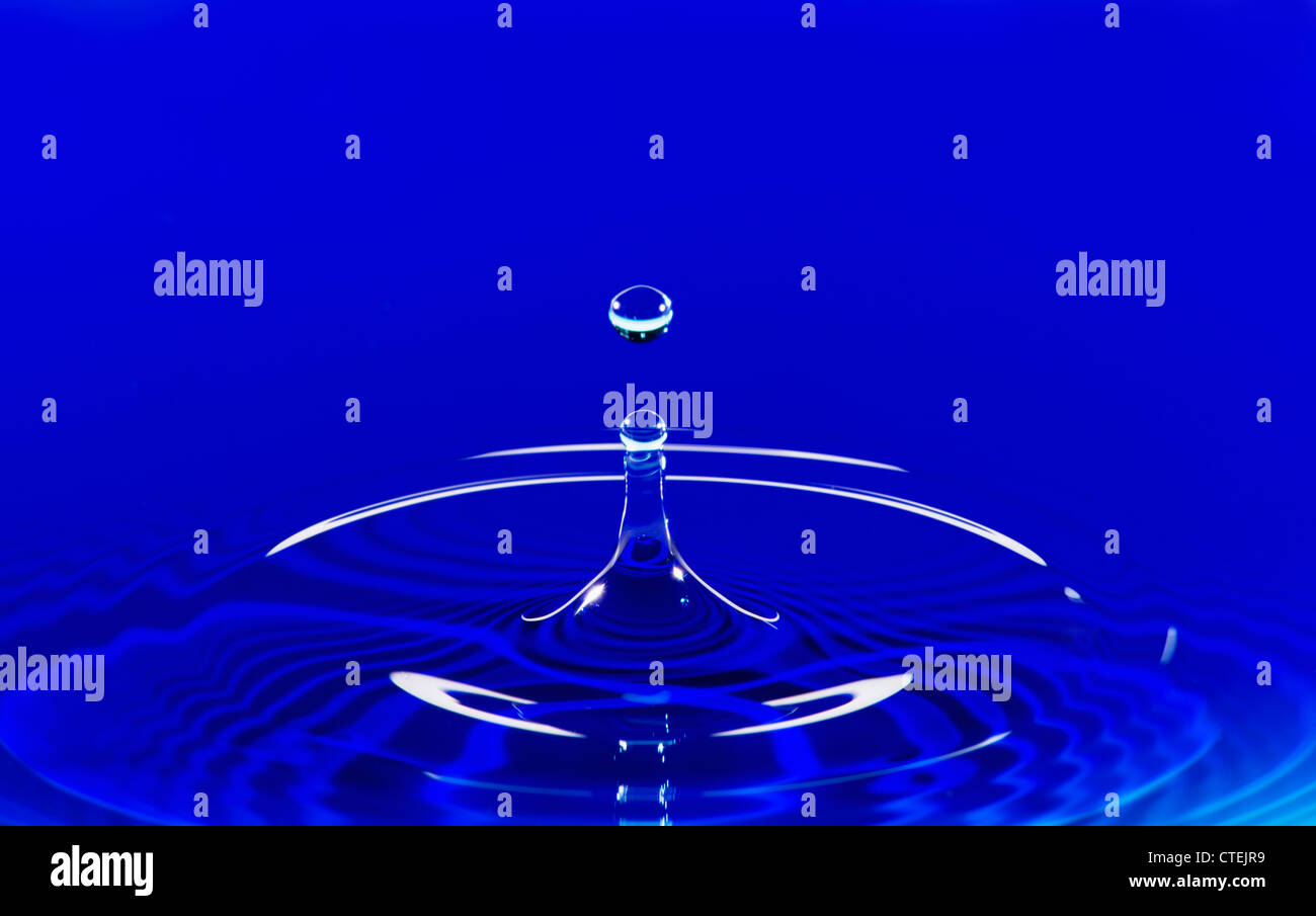 Blue water splashing Stock Photo - Alamy
