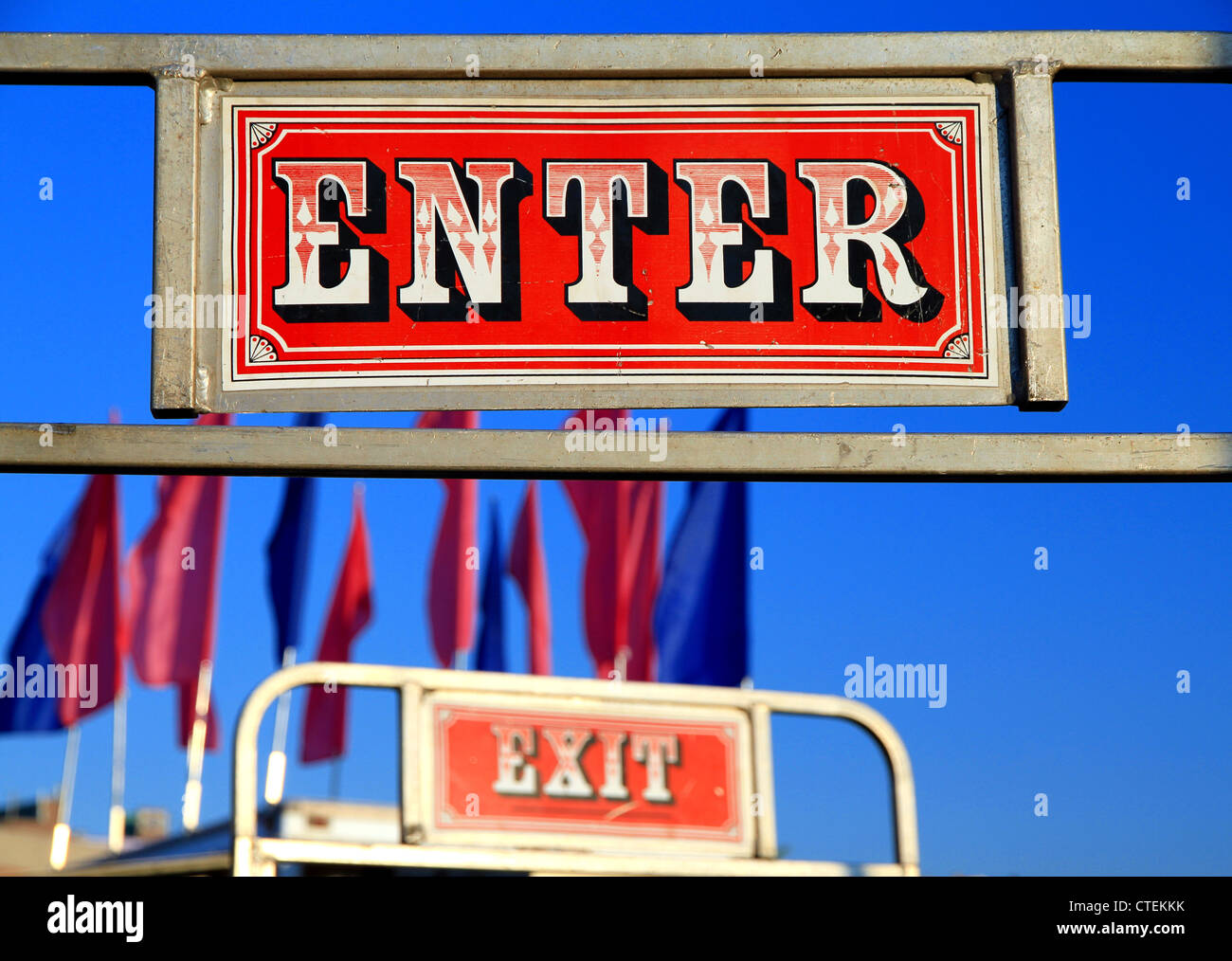 Old-fashioned Enter and Exit signs at a theme park Stock Photo - Alamy