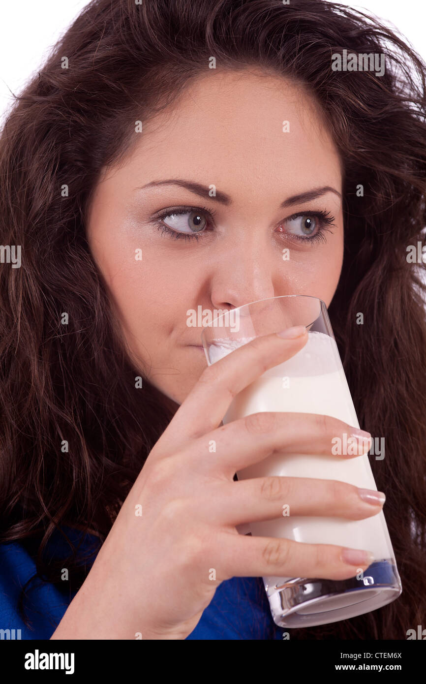 beautiful smiling woman is drinking milk isolated on white background ...