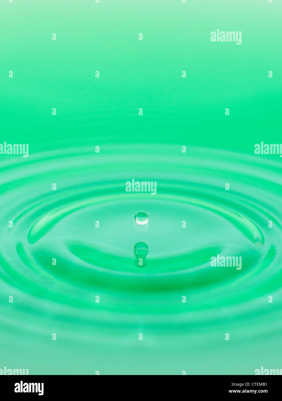 Drop falling into water Stock Photo - Alamy