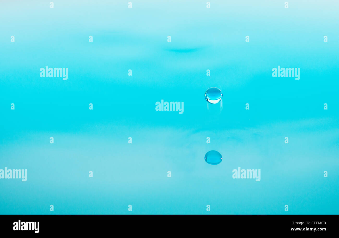 Drop falling into water Stock Photo - Alamy