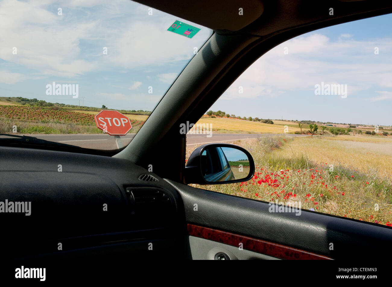 Crossroads and stop sign, viewed from inside a car Stock Photo - Alamy