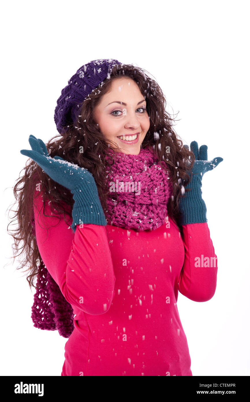 beautiful smiling brunette woman in snow in winter isolated on white ...