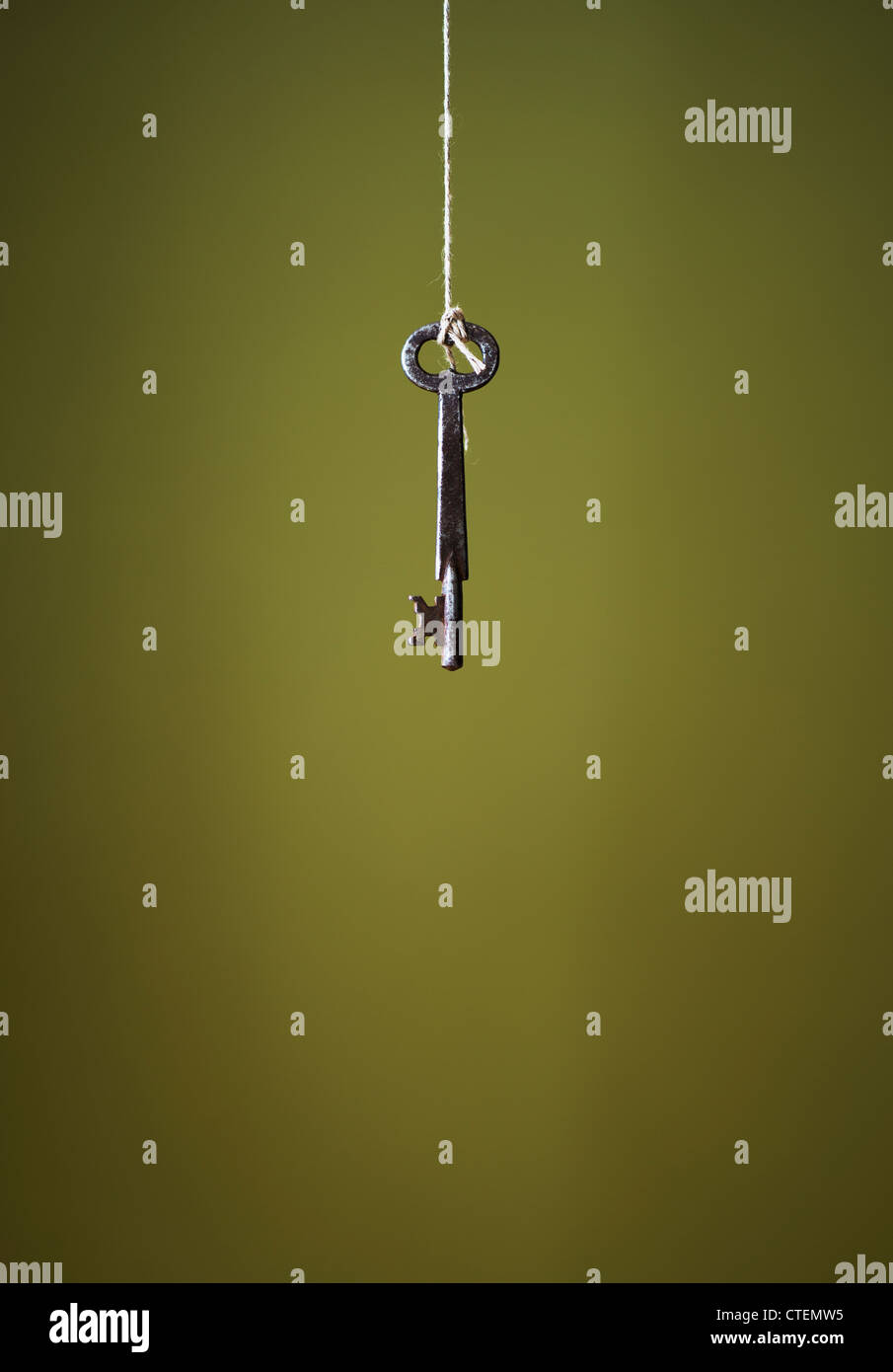 Key hanging on string Stock Photo - Alamy
