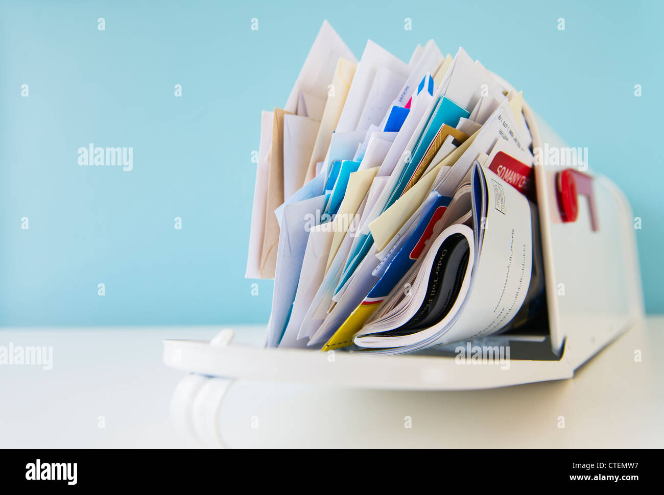 Mailbox full of correspondence Stock Photo - Alamy