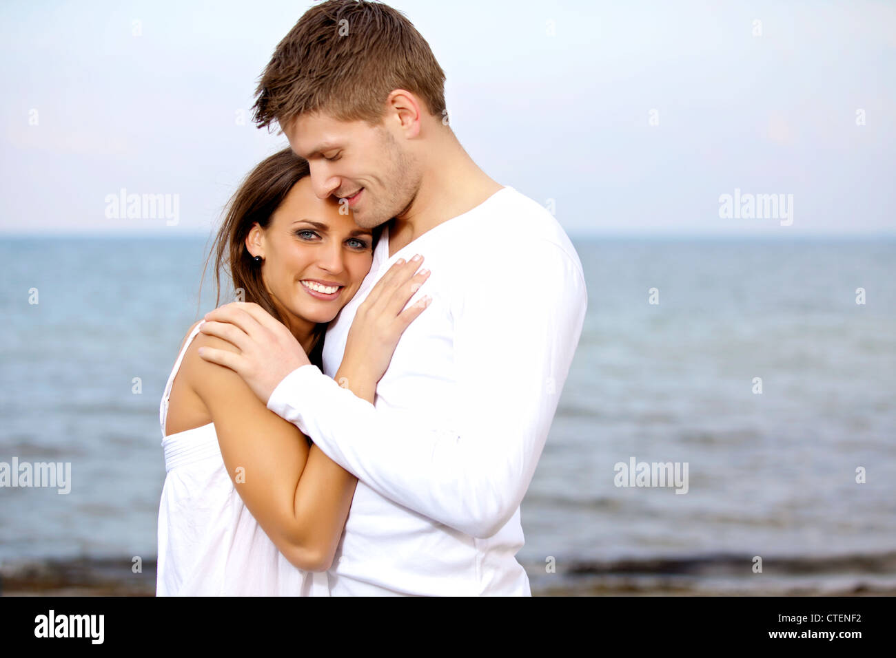 Lovely couple cuddling relaxing hi-res stock photography and images - Alamy