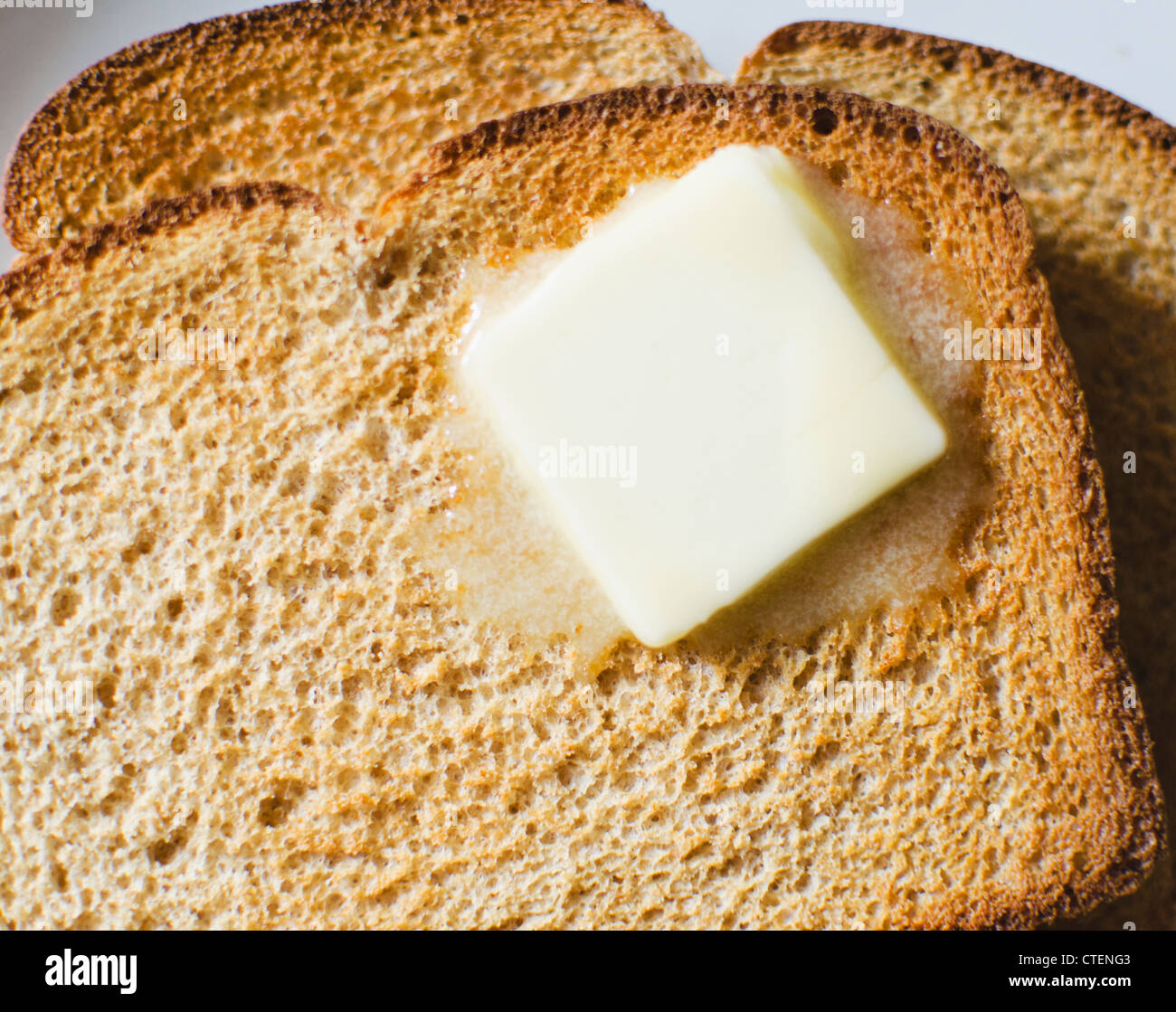 Toast with meltin butter Stock Photo - Alamy