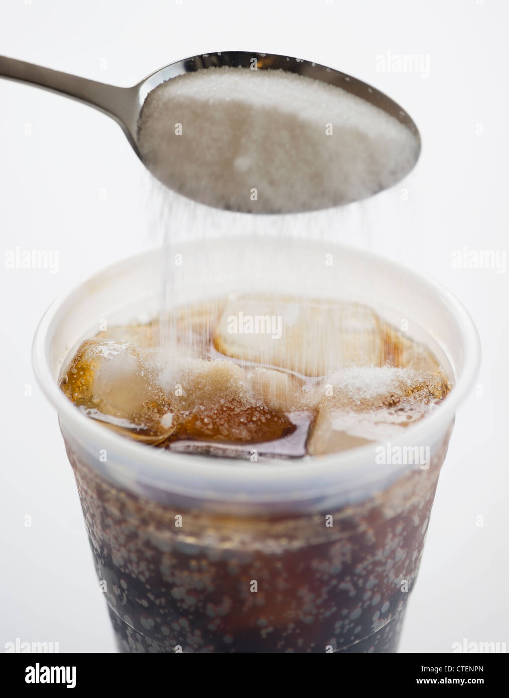 Adding sugar into soda Stock Photo - Alamy