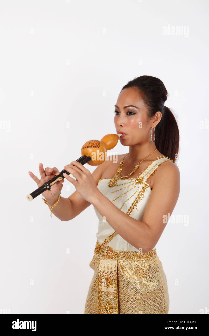 Young woman playing a Hulusi flute Stock Photo - Alamy